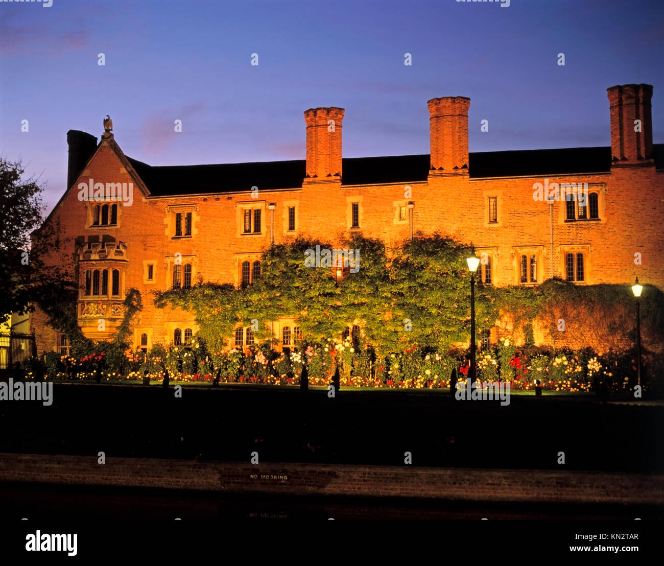 Magdalene College illuminated at night and the River Cam in the ...