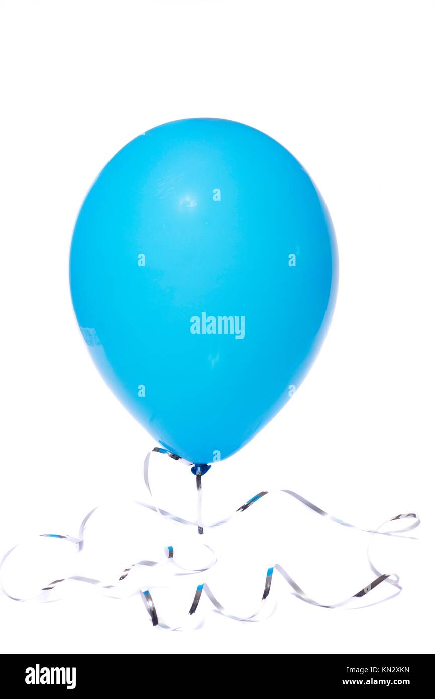 Close view of a blue inflated balloon isolated on a white background ...