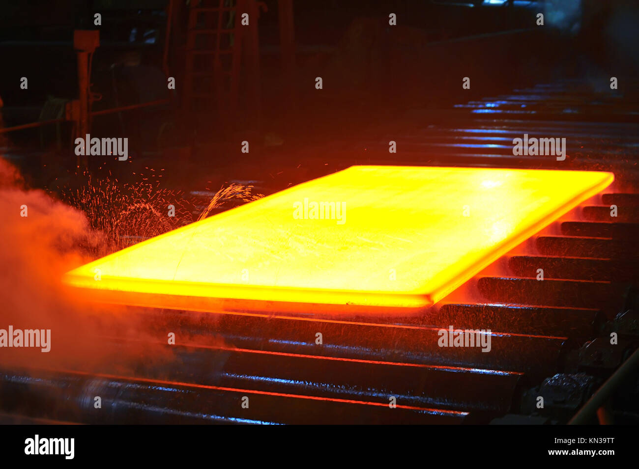 hot steel on conveyor Stock Photo - Alamy