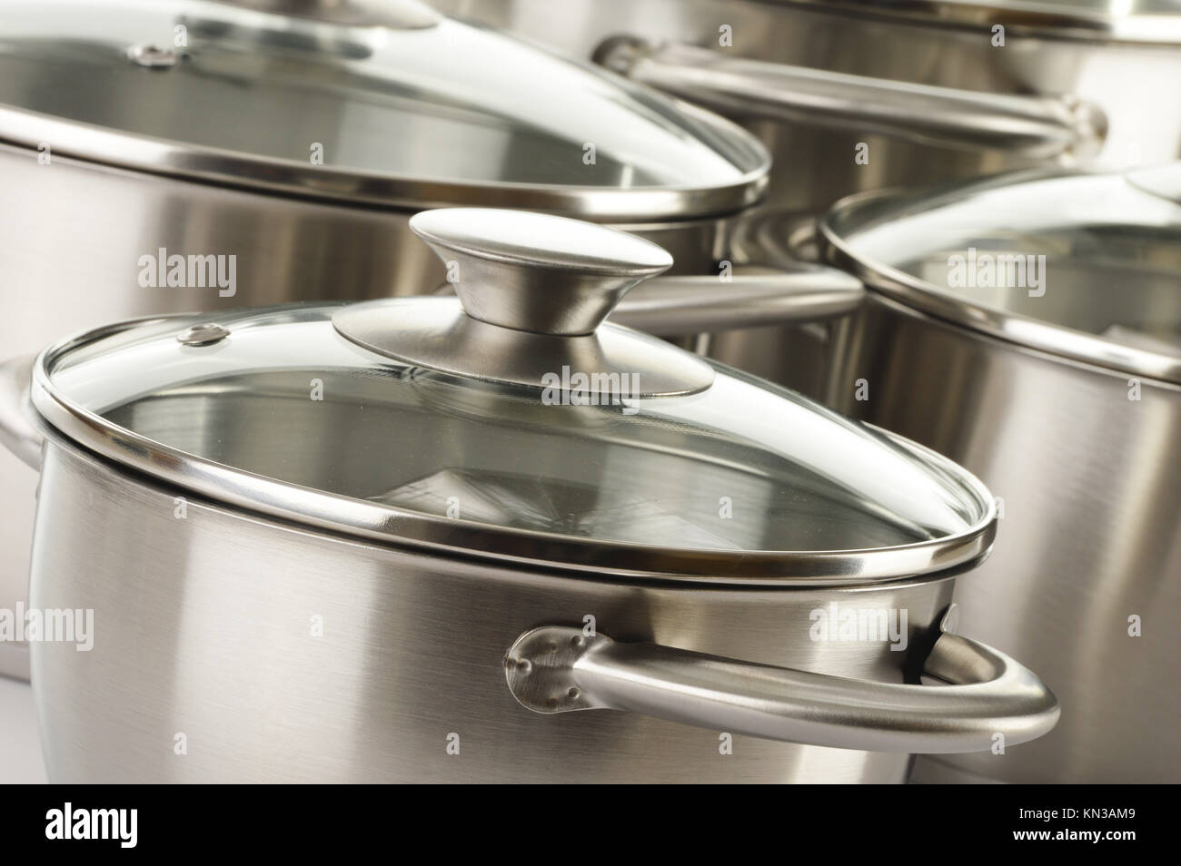 Composition with stainless pots Stock Photo - Alamy