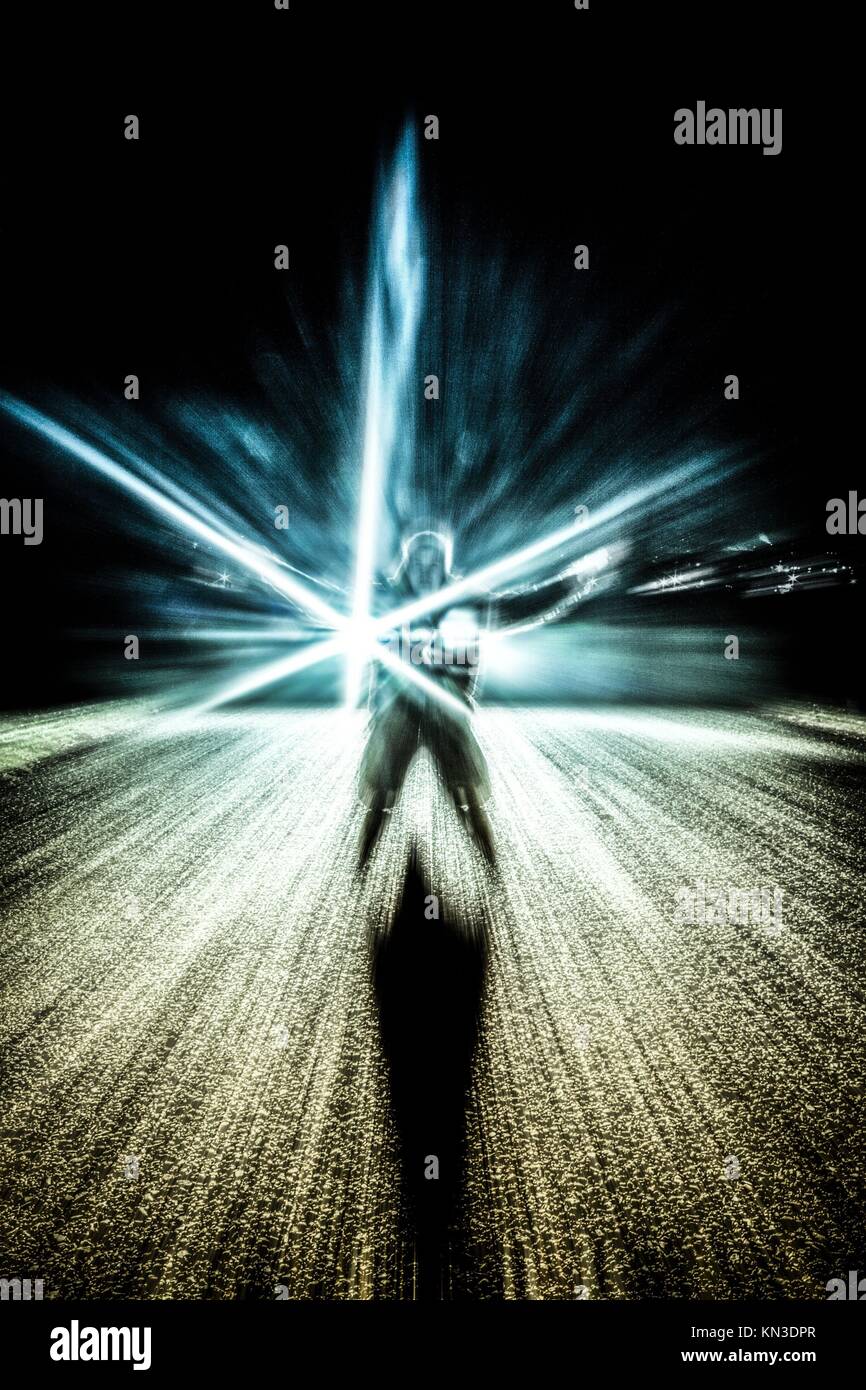 Abstract photo of a man and light effects over dark background Stock ...