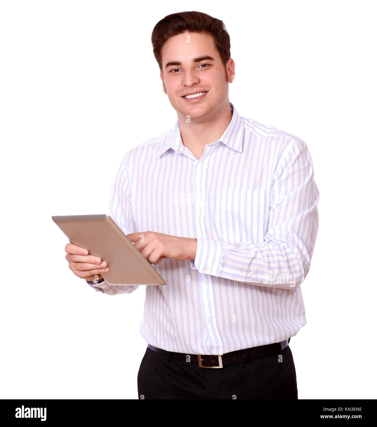 Portrait of a cute guy on white shirt working with his tablet pc while ...