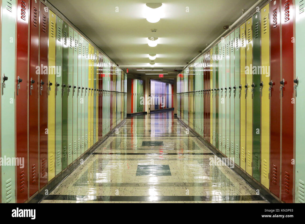 Tunnel-like hallway lined with multi-colored lockers Stock Photo - Alamy