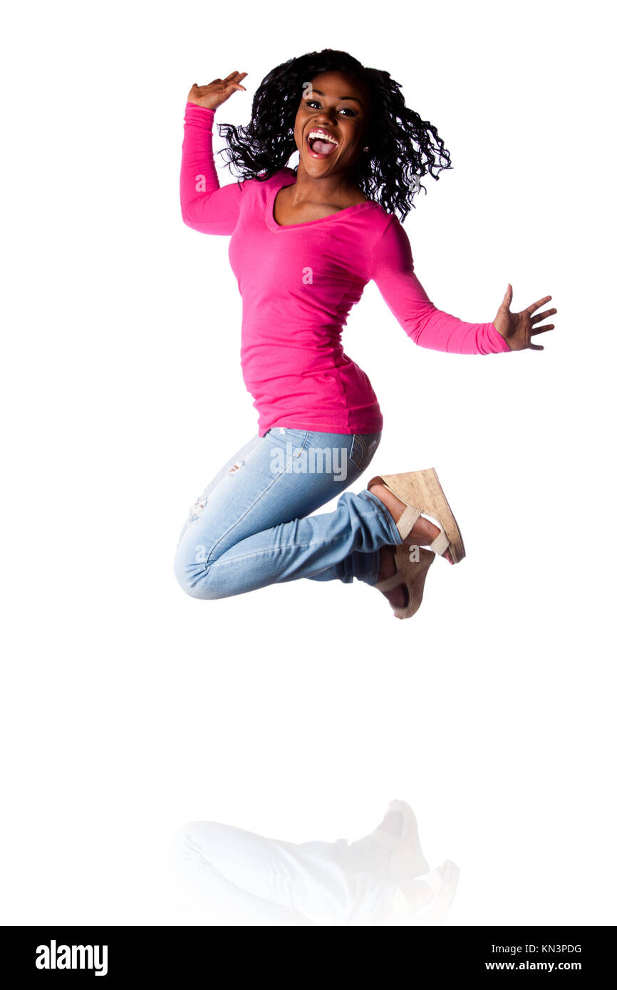 Beautiful young woman jumping of happiness celebrating and cheering ...