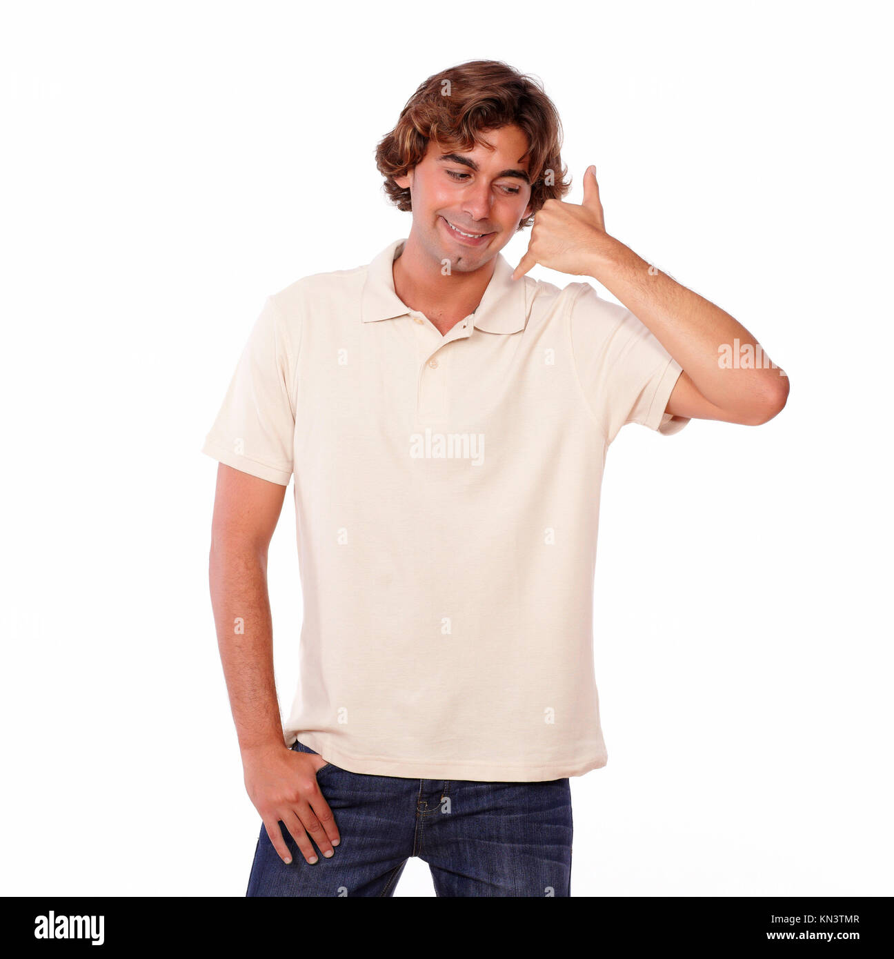 Portrait of a handsome man gesturing call me sign with fingers on ...