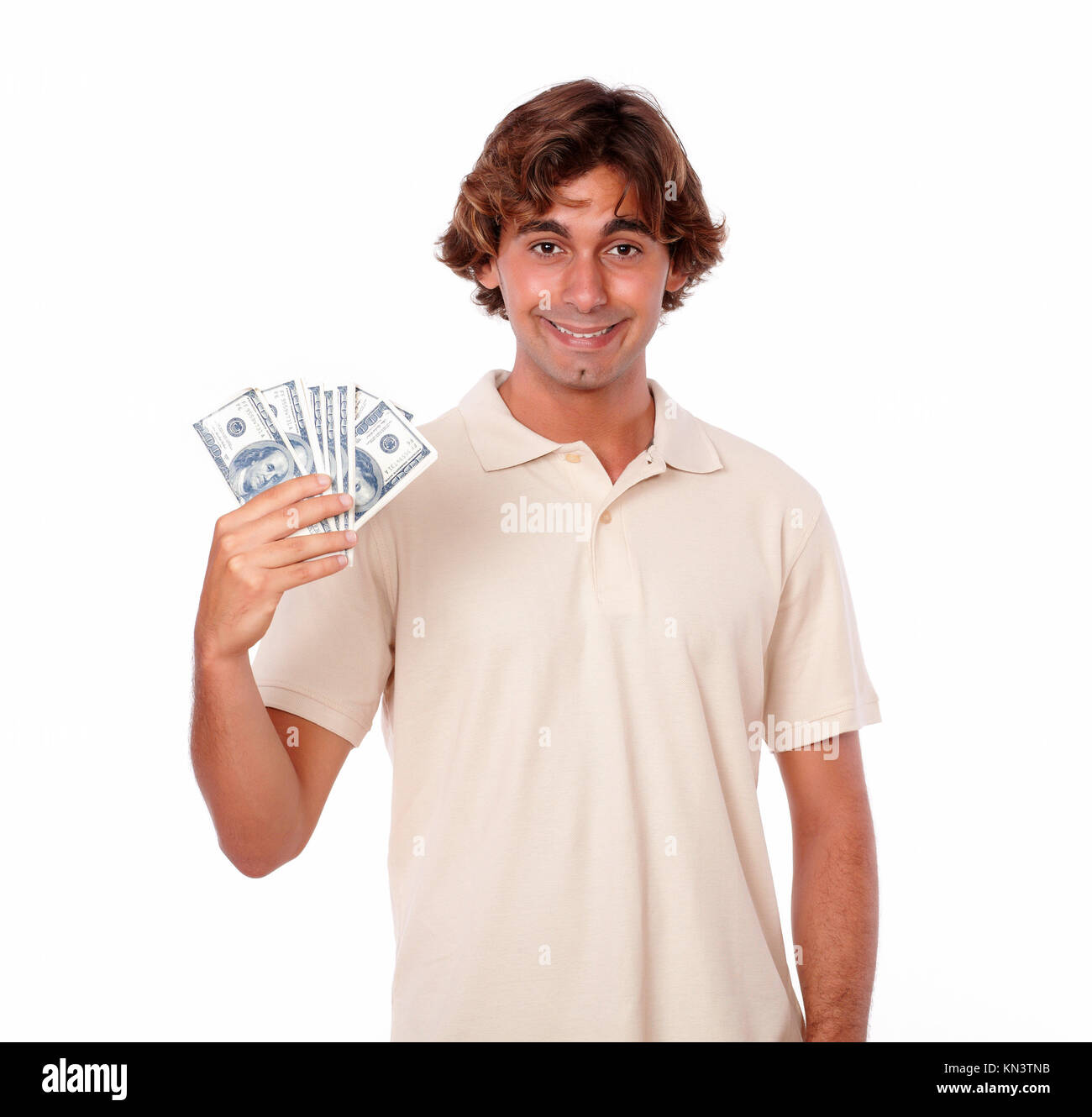 Portrait of a charismatic young man holding cash money on white ...