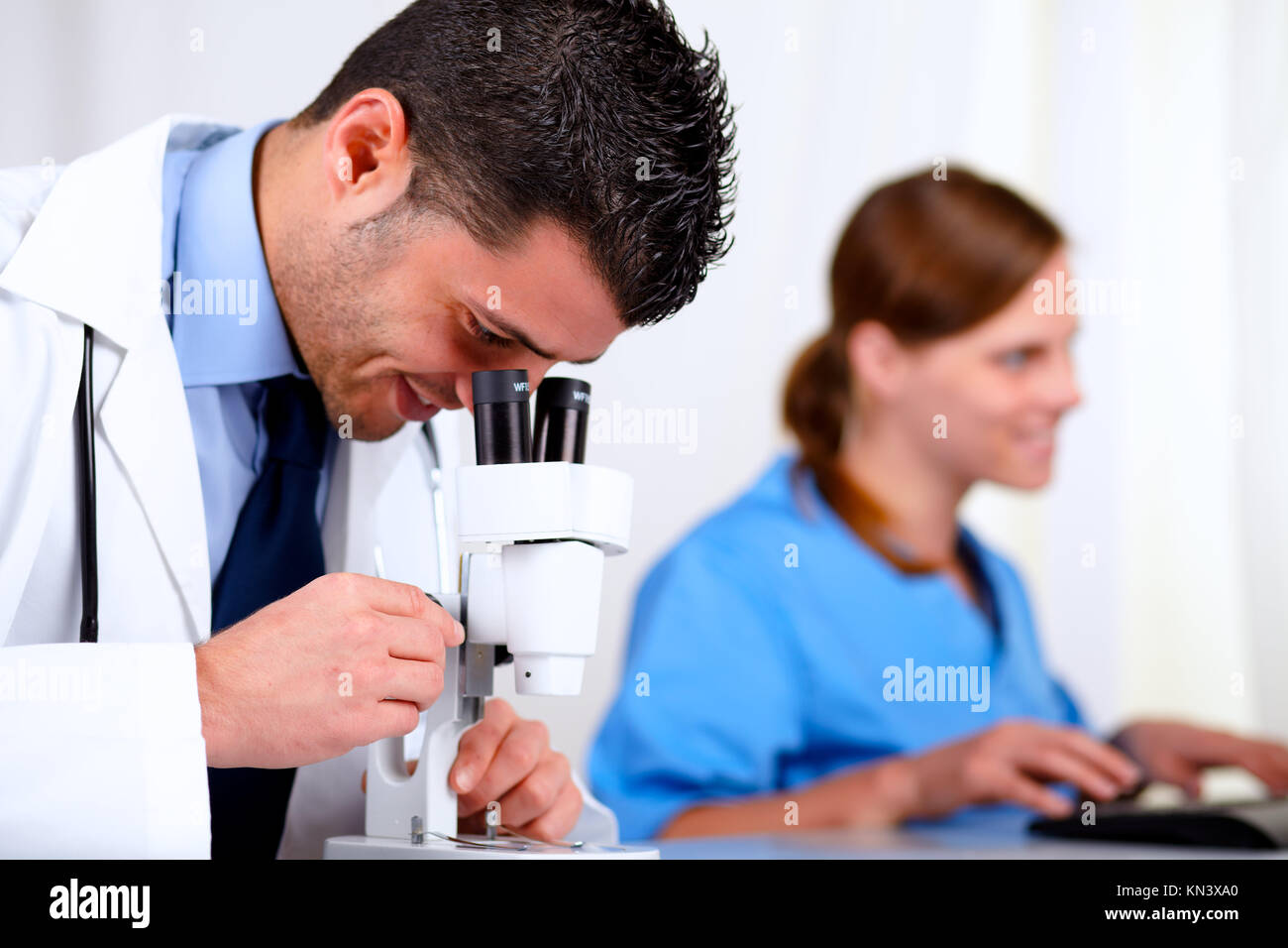 Portrait of two medical colleagues working at laboratory at hospital ...