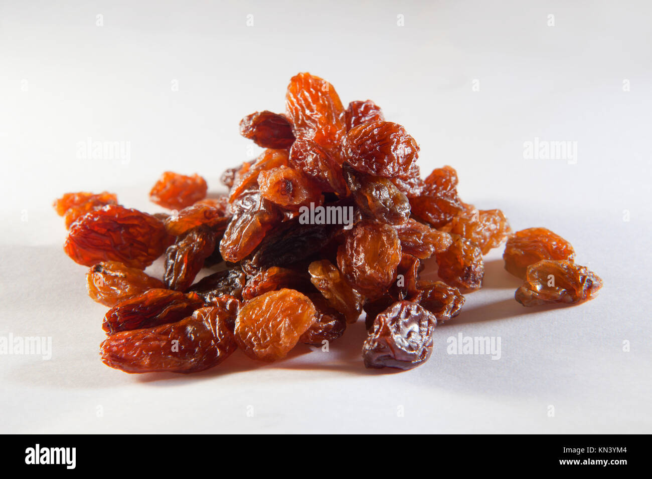 Bunch of dried grapes isolated on white Stock Photo - Alamy