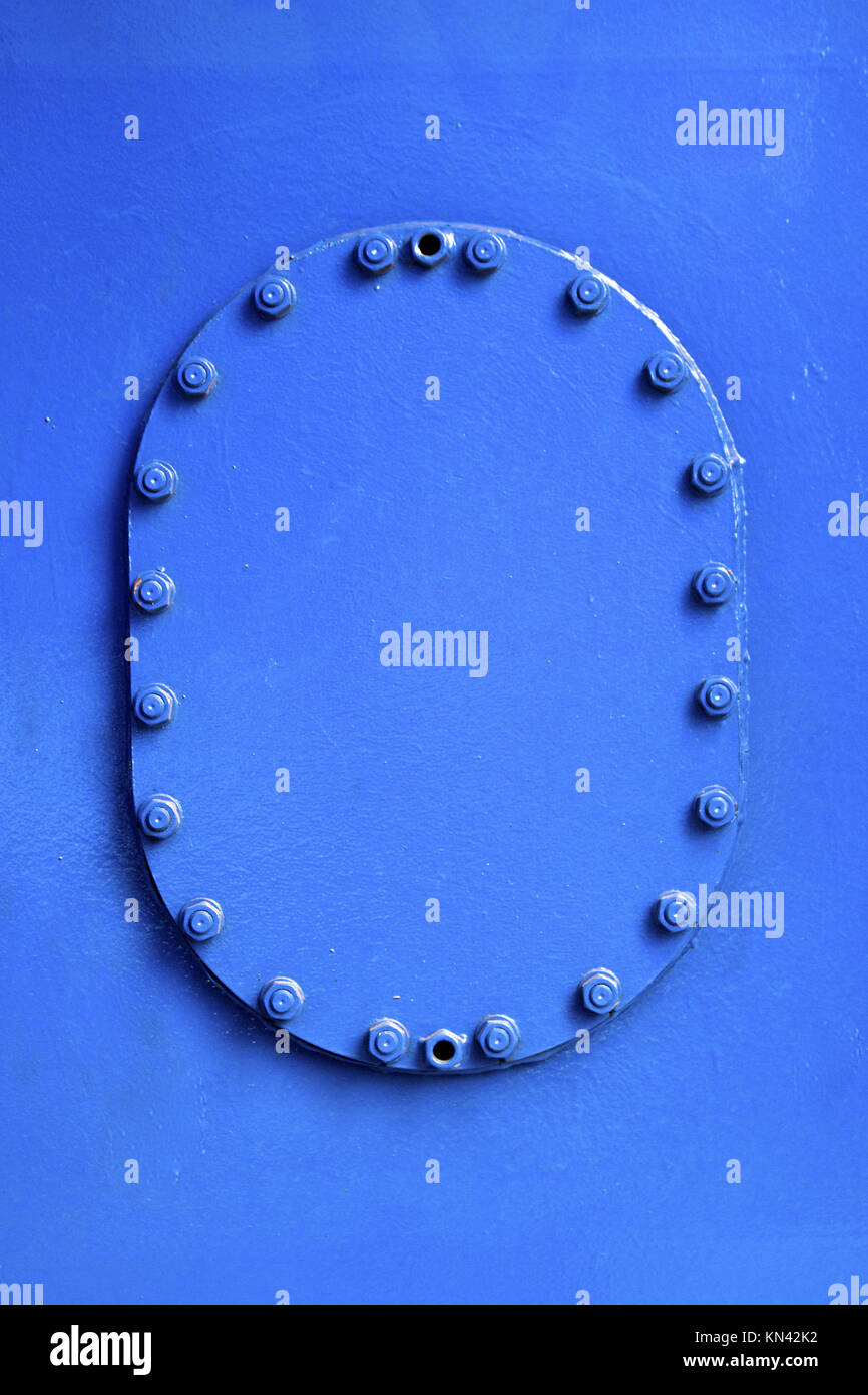 A bolted cover on a ship, painted in vibrant blue Stock Photo - Alamy