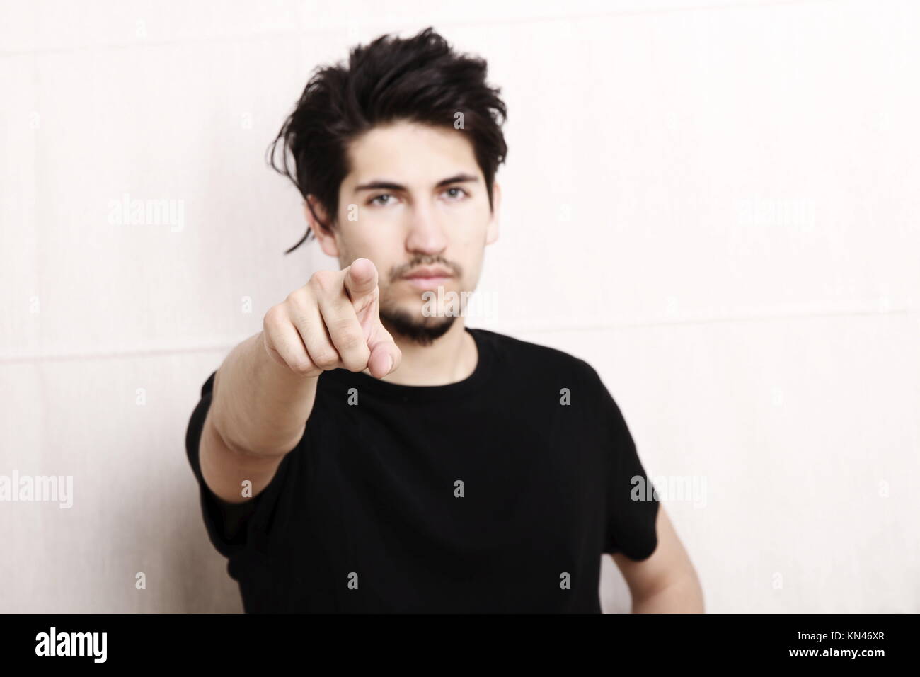 A young man pointing at you Stock Photo - Alamy