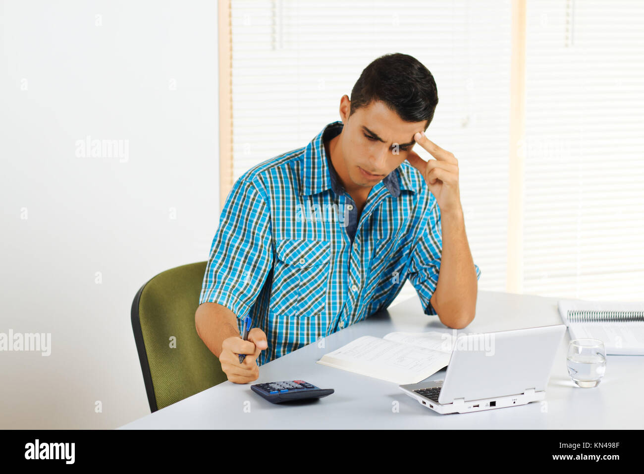 Frustrated looking at paper work hi-res stock photography and images ...
