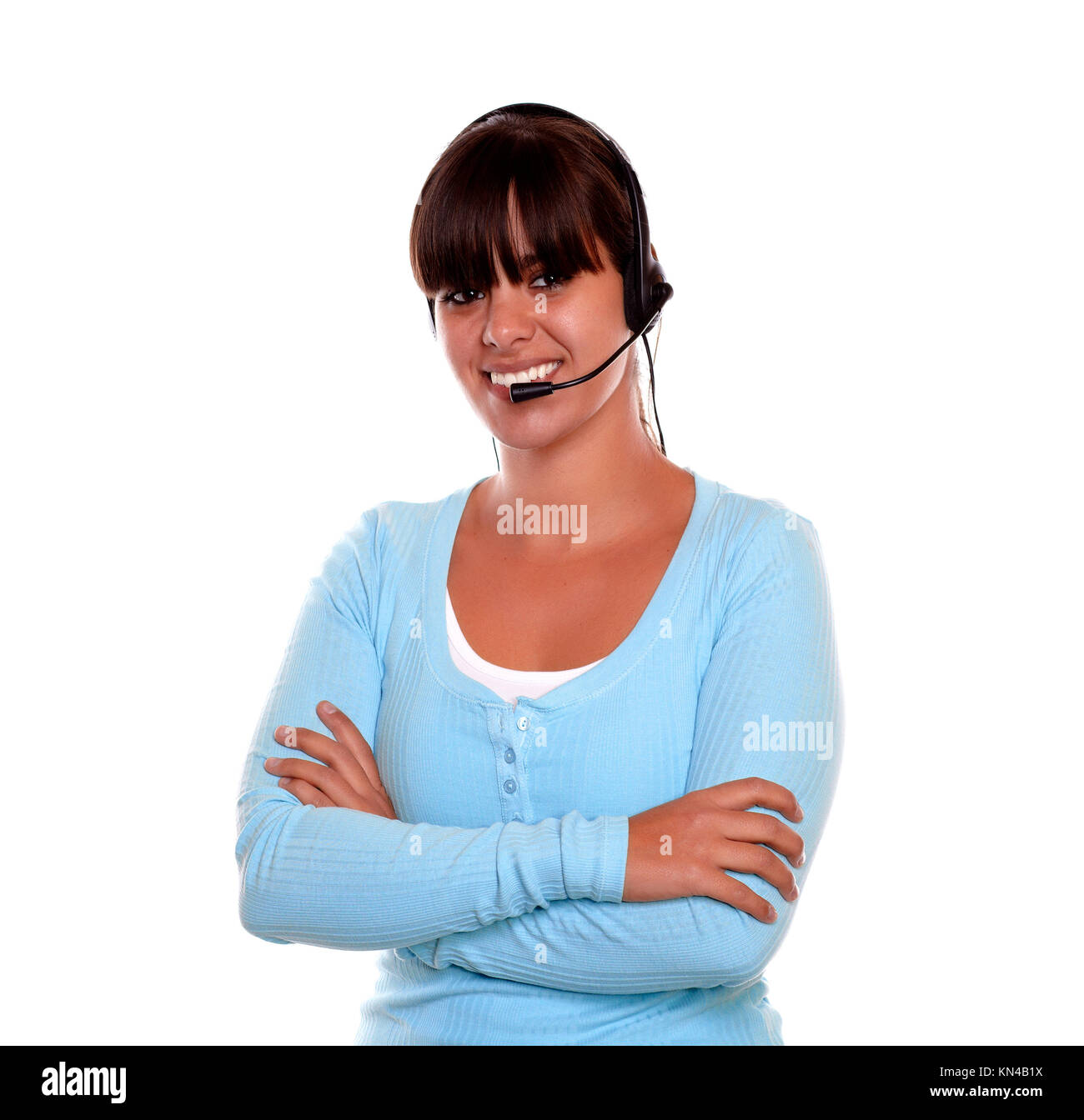 Portrait of a pretty call center employee smiling at you while wearing ...