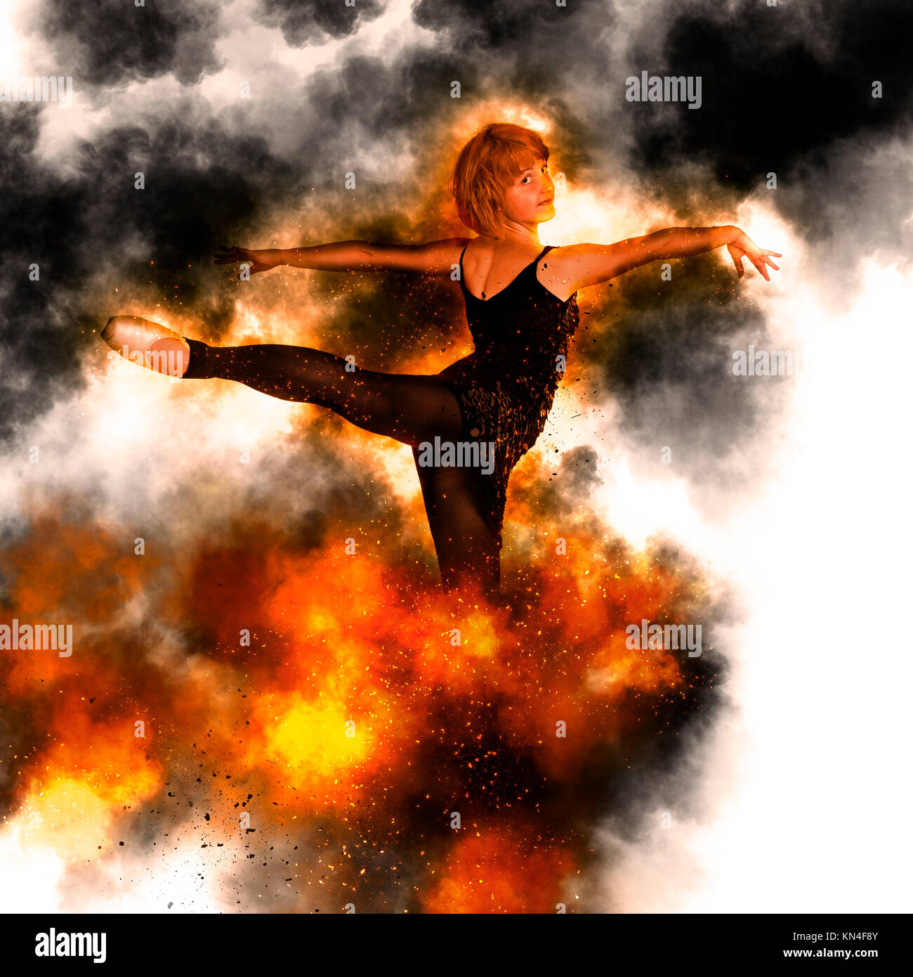 Female Ballet Dancer balances on her toes in a classical ballet stance ...