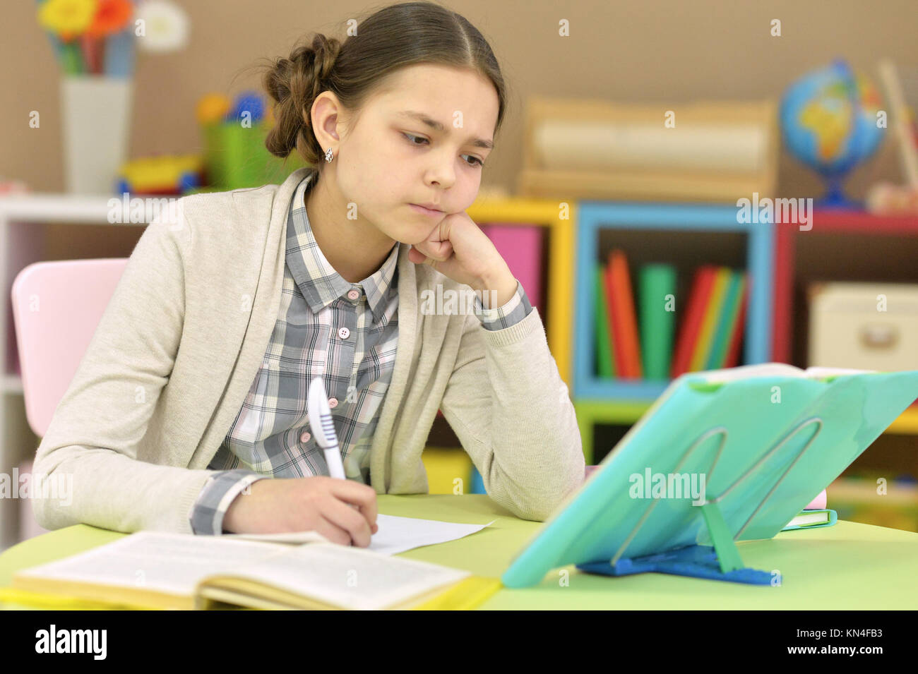 schoolgirl doing homework Stock Photo - Alamy