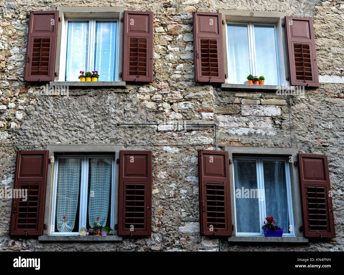 Vintage wall and four blue windows hi-res stock photography and images ...