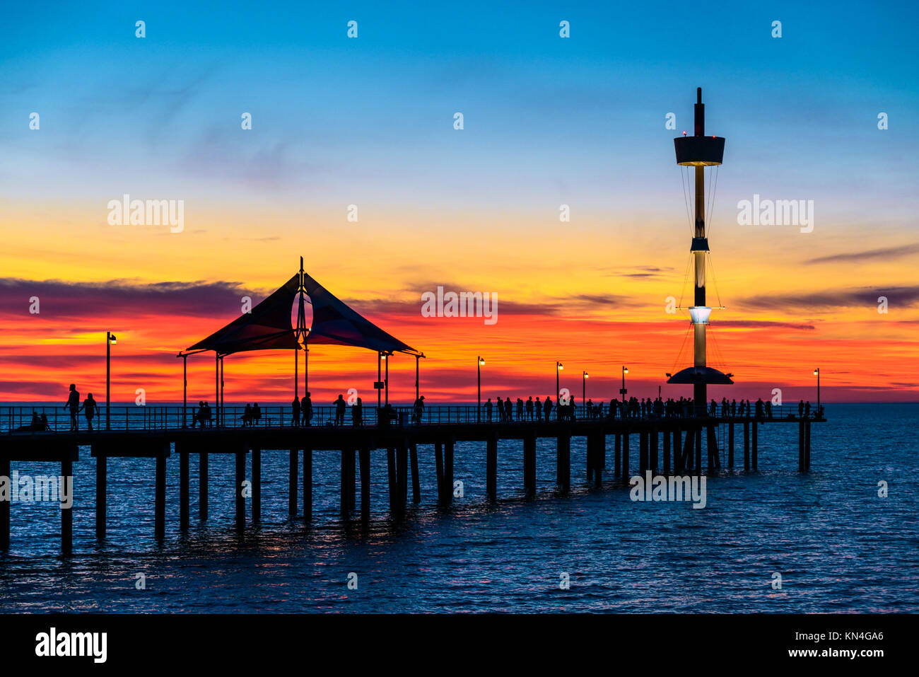 People walking along Brighton Jetty at sunset. South Australia Stock ...