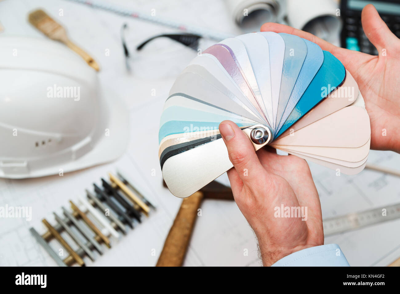 Architect hands with material sample, renovation concept Stock Photo ...