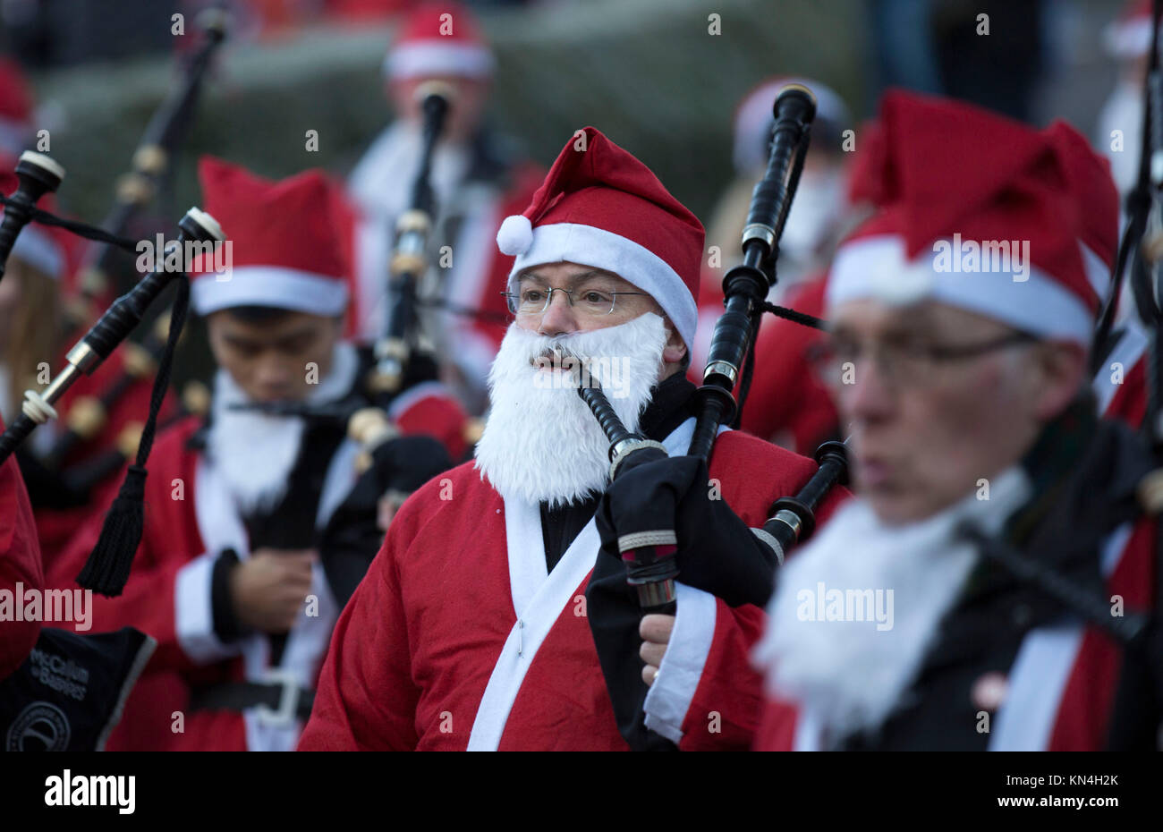 People dressed as Father Christmas take part in the Great Edinburgh ...