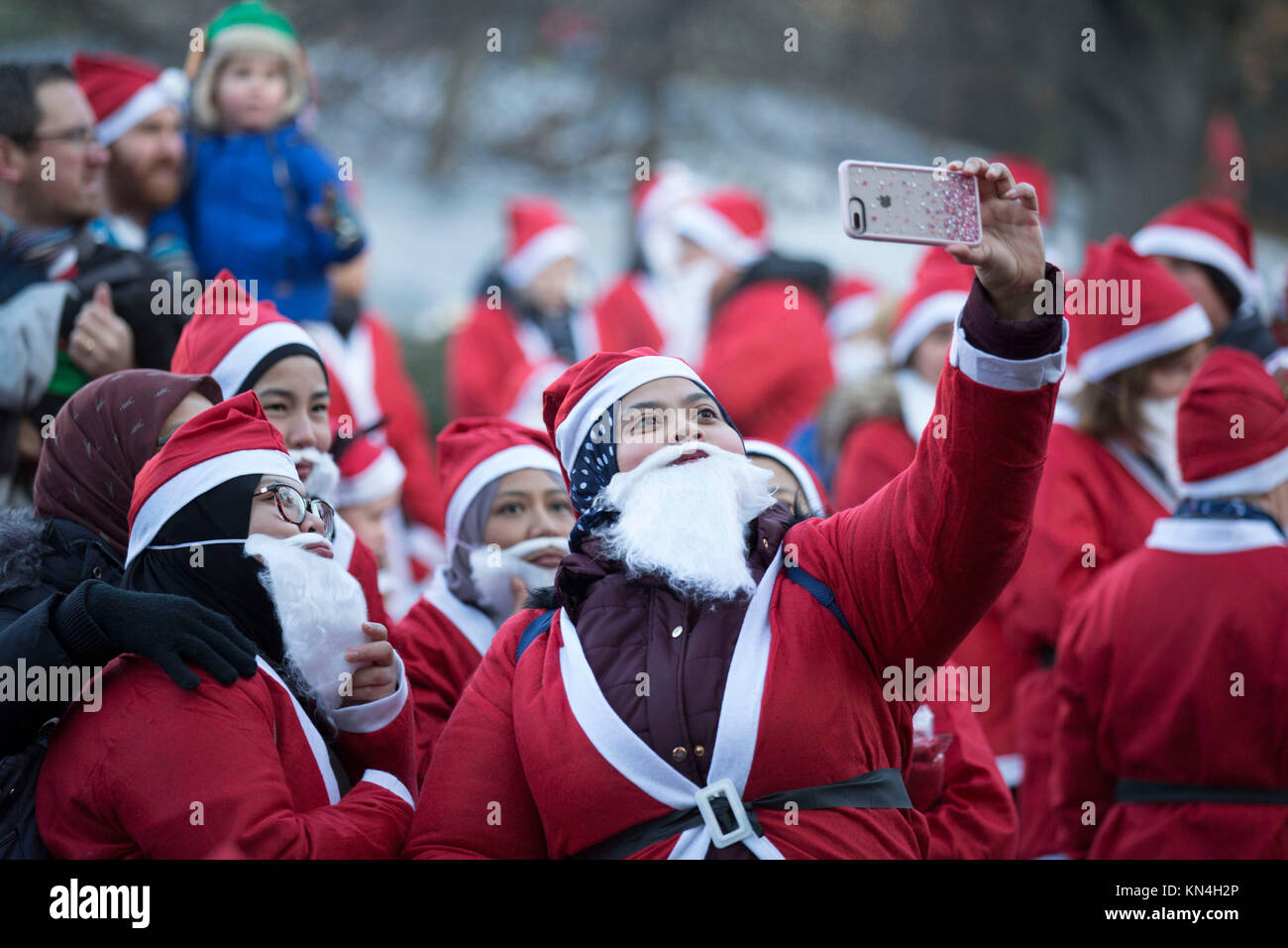 People dressed as Father Christmas take part in the Great Edinburgh ...