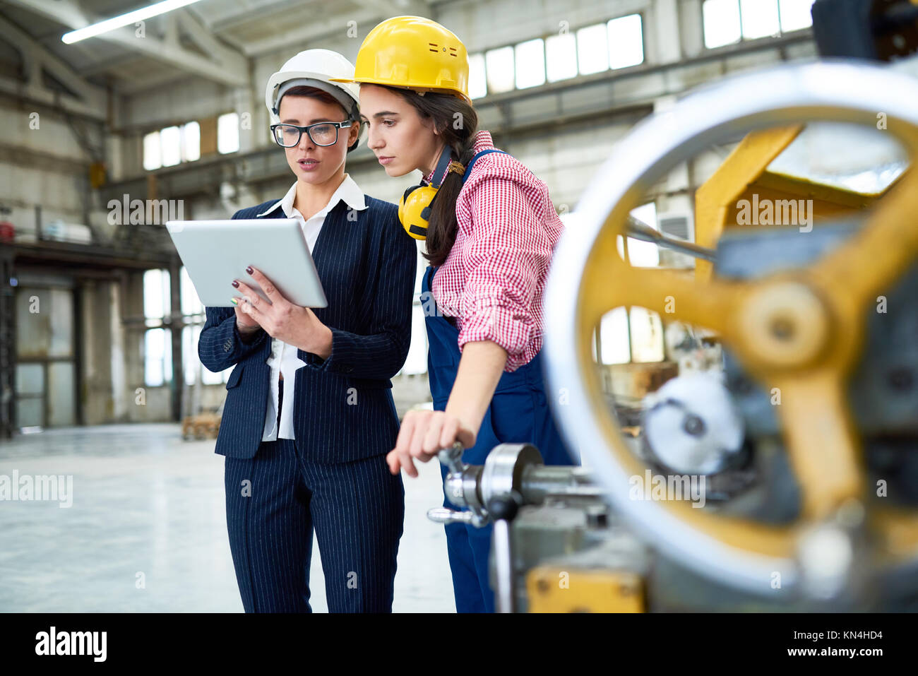 Brief Discussion at Production Department Stock Photo - Alamy