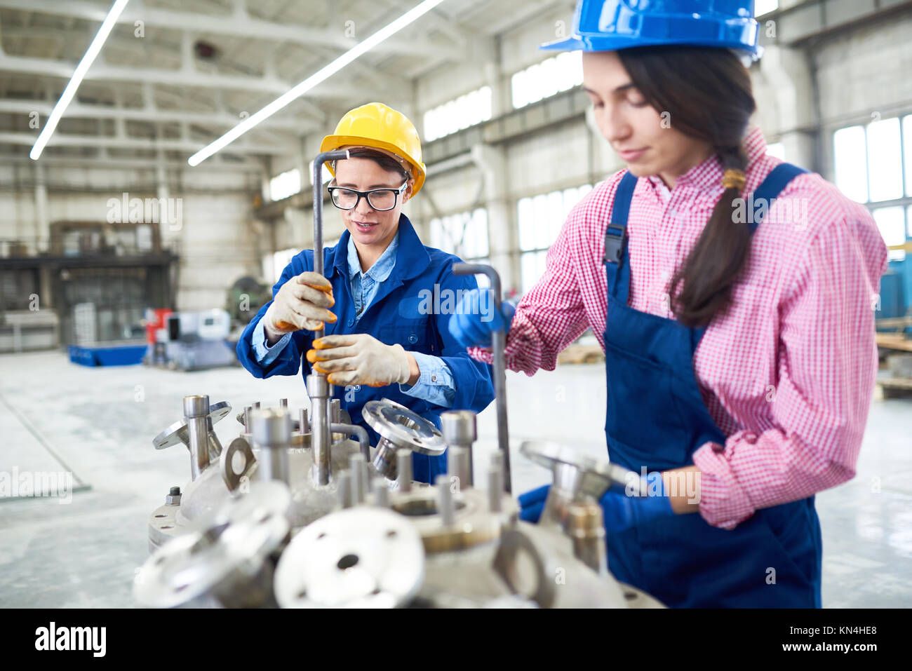 Factory Workers Using Hex Keys Stock Photo - Alamy