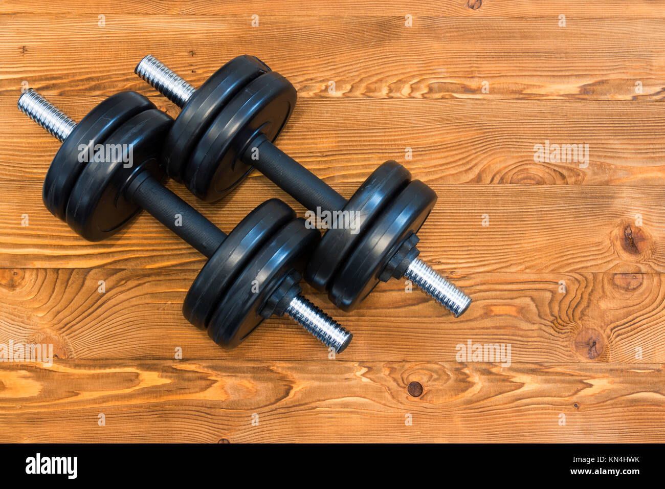 Top view of a dumbbells on a wooden background, health lifestyle ...