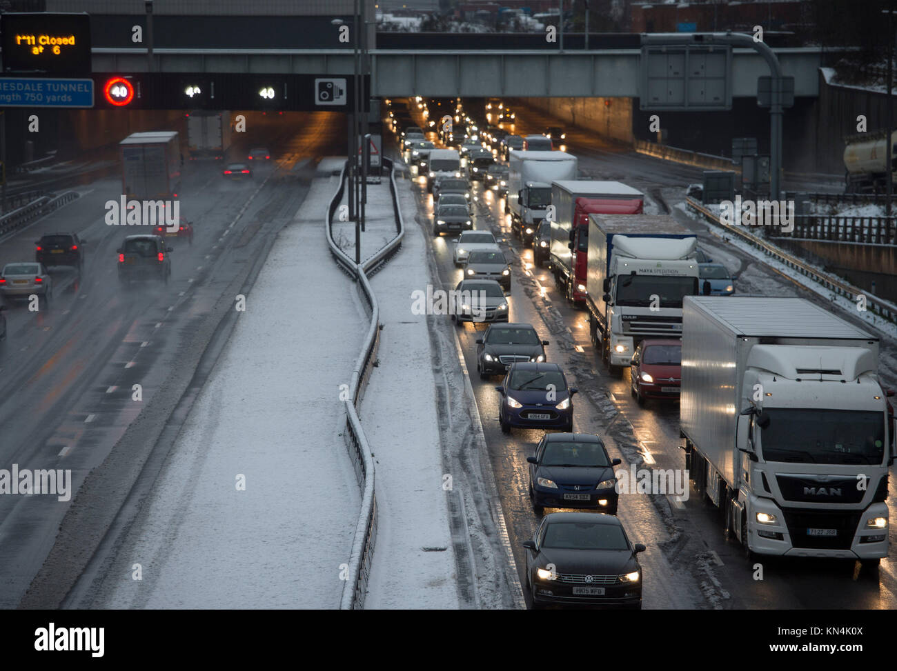 Heavy traffic on the M25 motorway near junction 25, as heavy snowfall ...