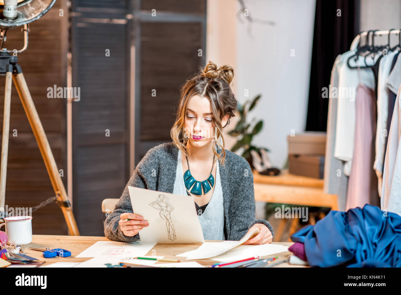 Fashion designer working at the office Stock Photo - Alamy