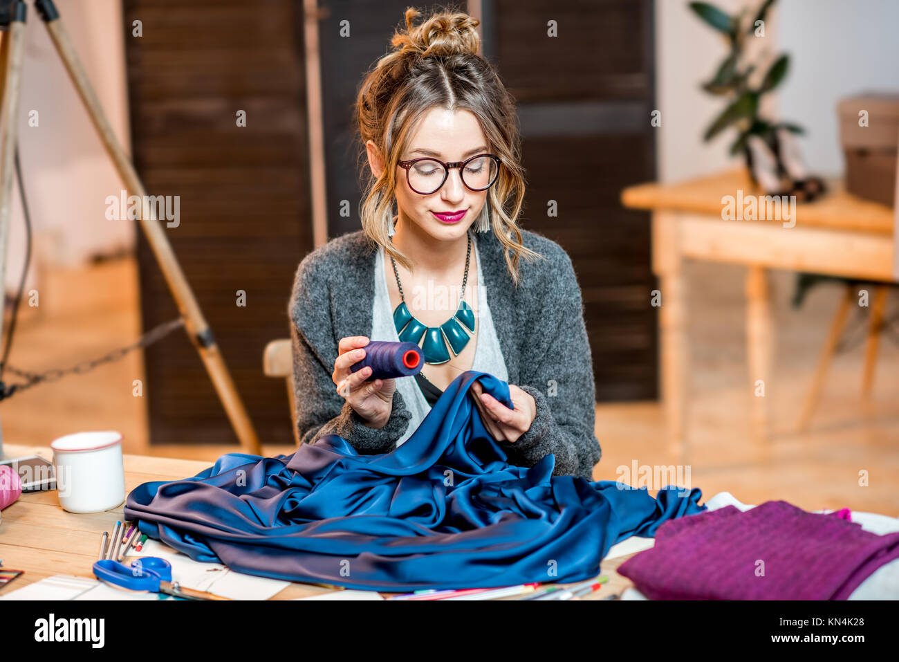 Fashion designer working at the office Stock Photo - Alamy