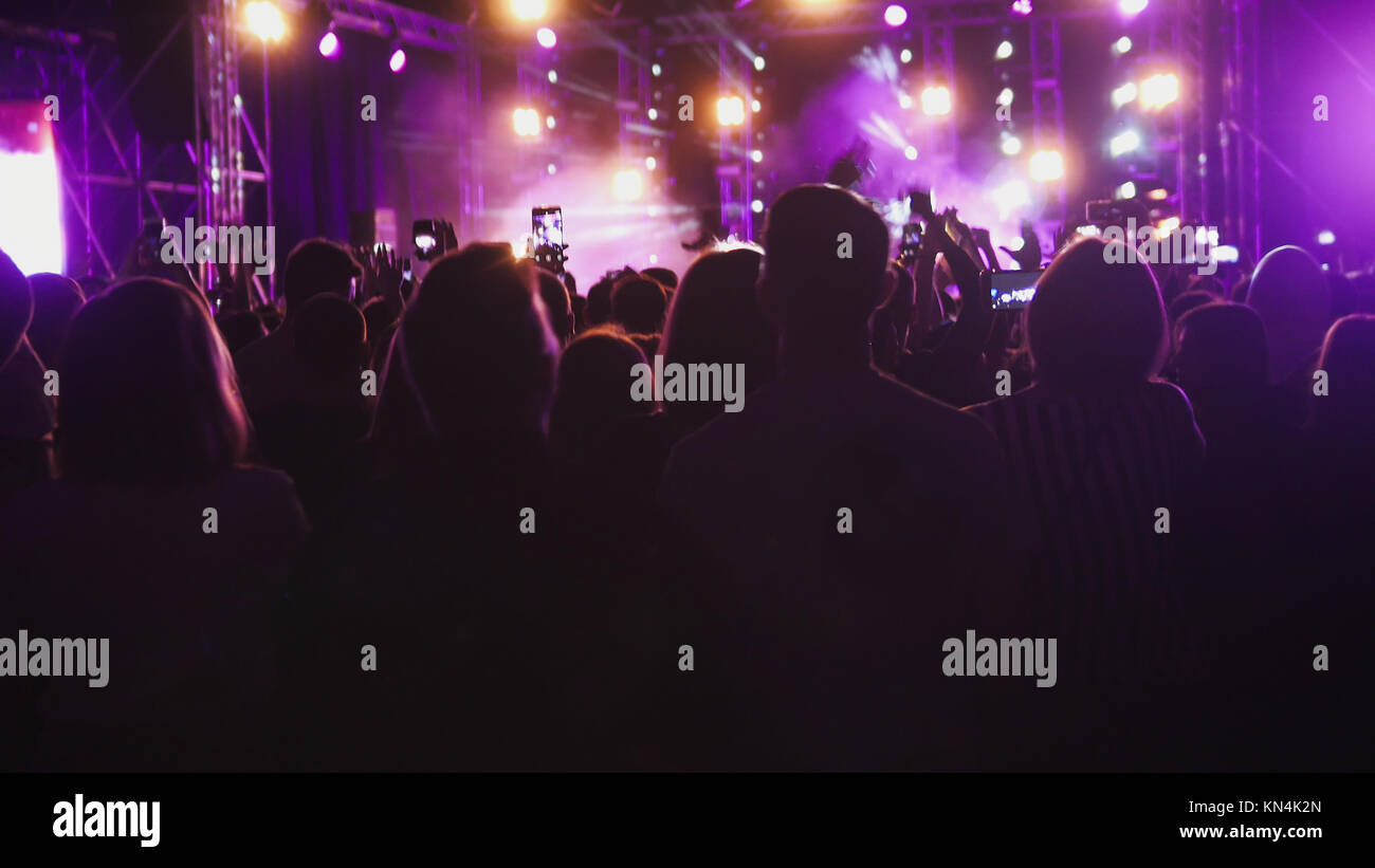 Young people dancing at the rep rock concert Stock Photo - Alamy