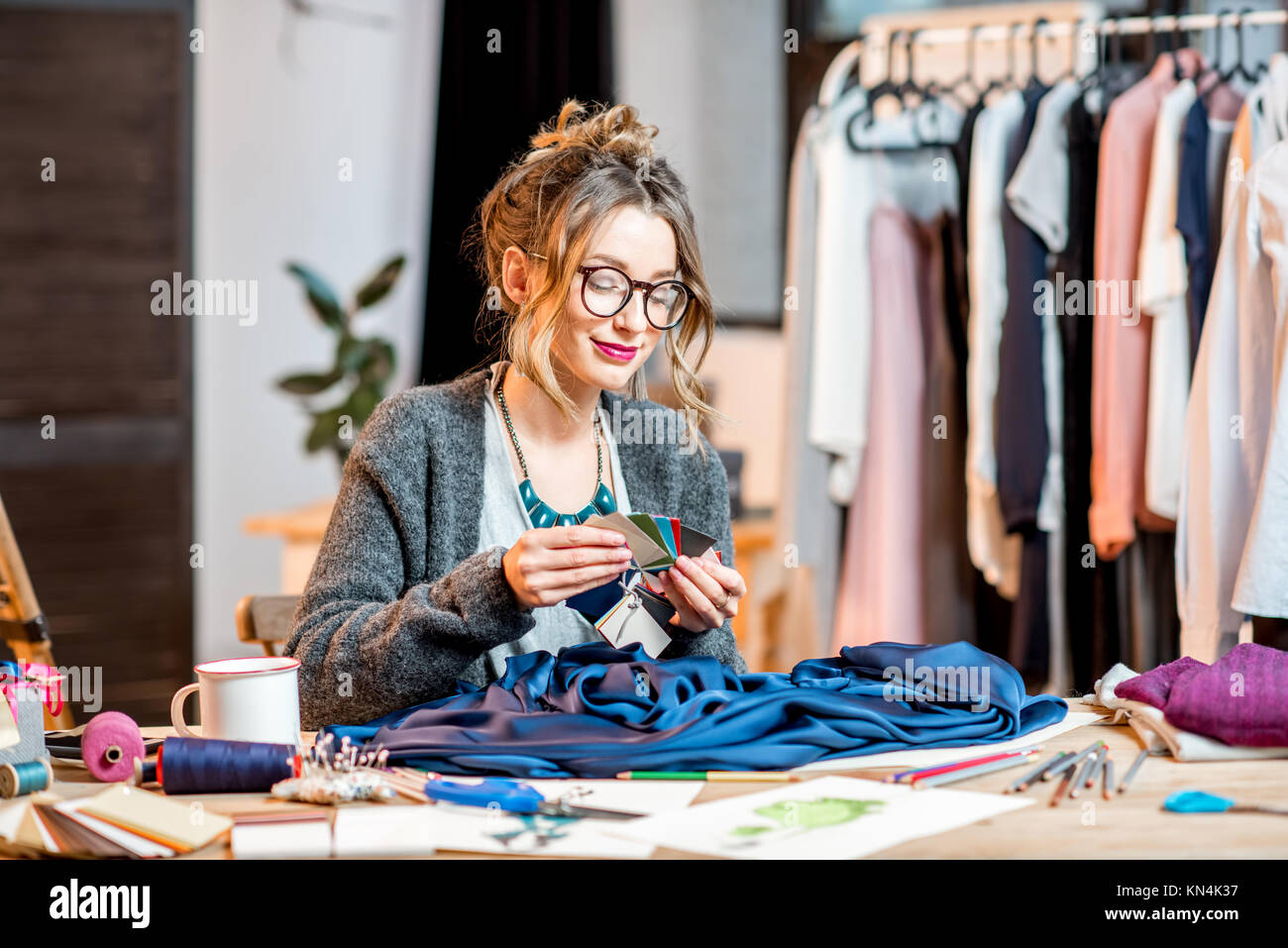 Fashion designer working at the office Stock Photo - Alamy