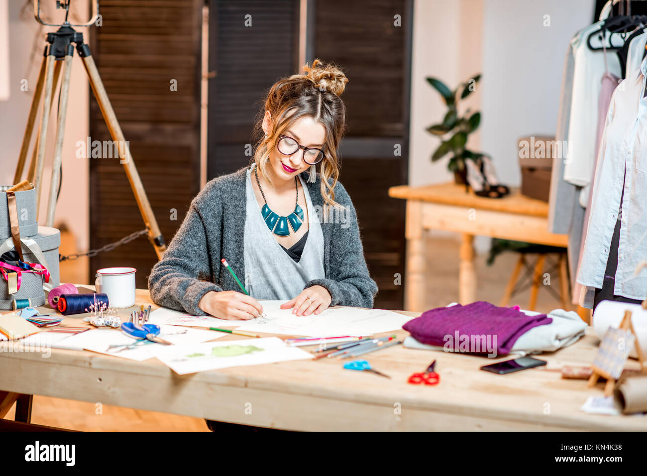Fashion designer working at the office Stock Photo - Alamy