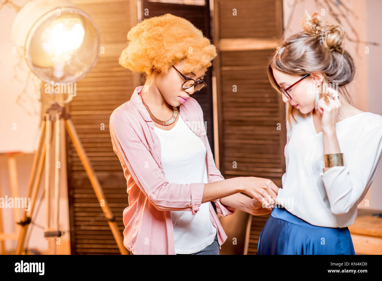 Tailor measuring woman client Stock Photo - Alamy