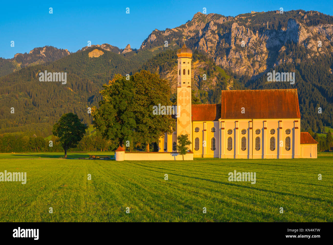 Baroque church St. Coloman, in the back mountain range Tegelberg ...