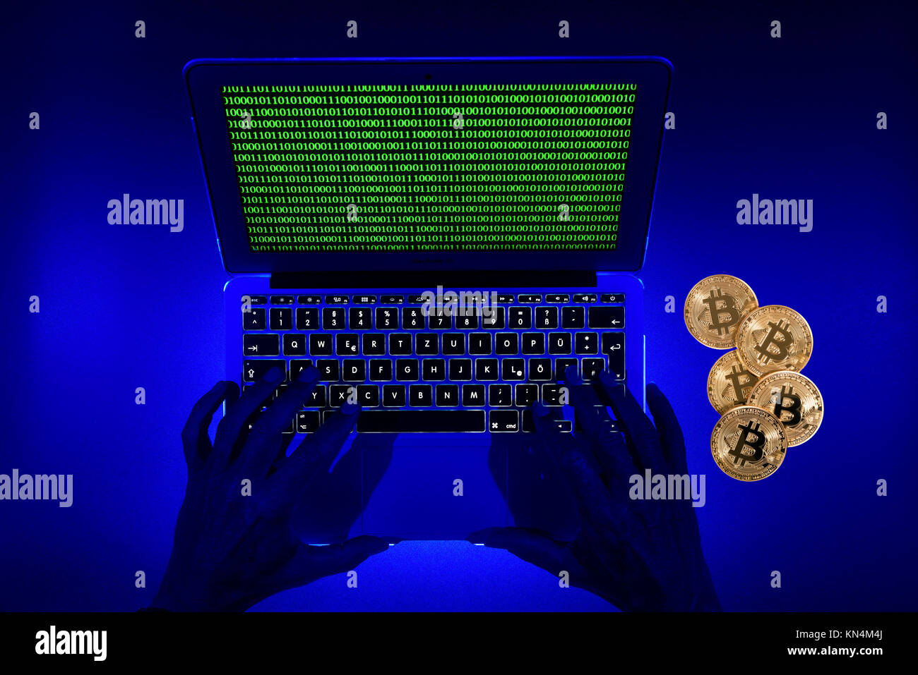 Symbol image digital currency, golden physical coin bitcoin laptop with digital binary hands ...