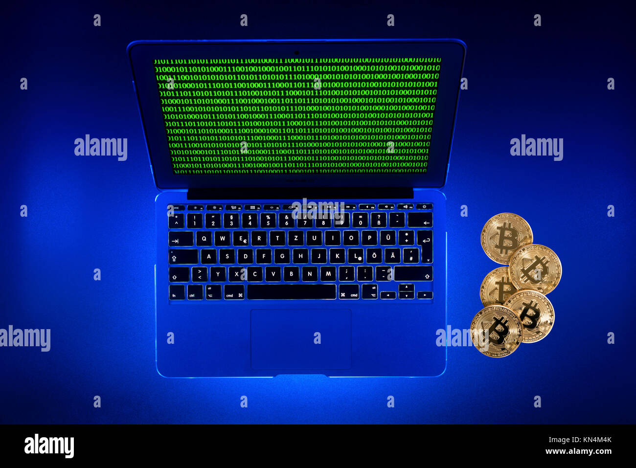 Symbol image digital currency, golden physical coin bitcoin laptop with digital binary code ...