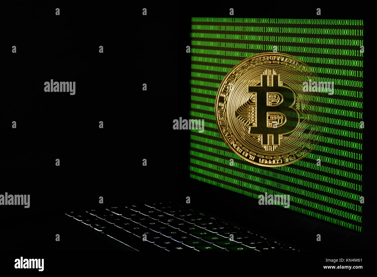 Symbol image cryptocurrency, digital currency, golden physical coin bitcoin laptop with digital ...