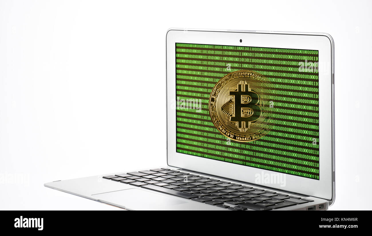 Symbol image cryptocurrency, digital currency, golden physical coin bitcoin laptop with digital ...