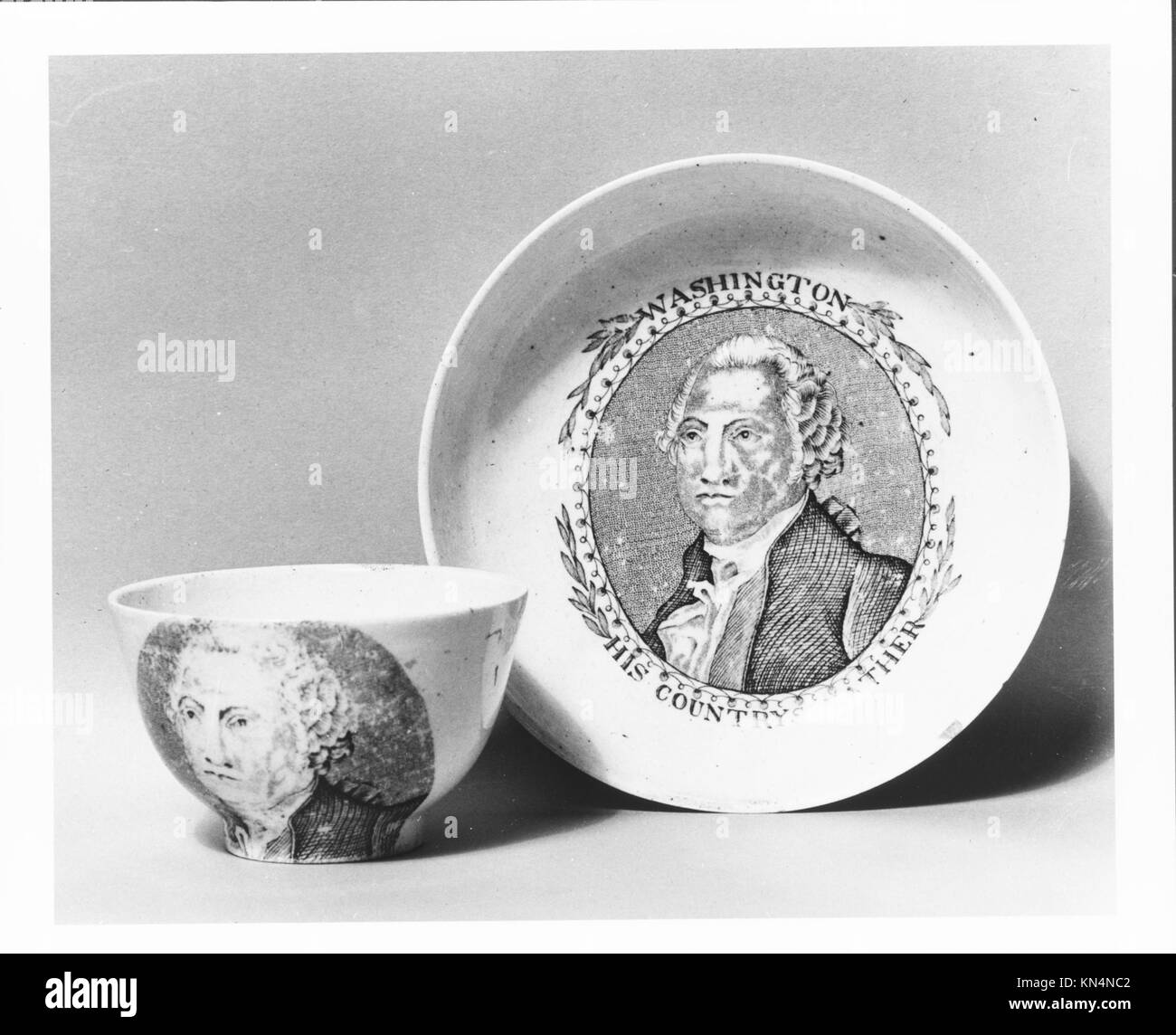 This cup and saucer set, made by Ralph Hall & Son, features a transfer ...