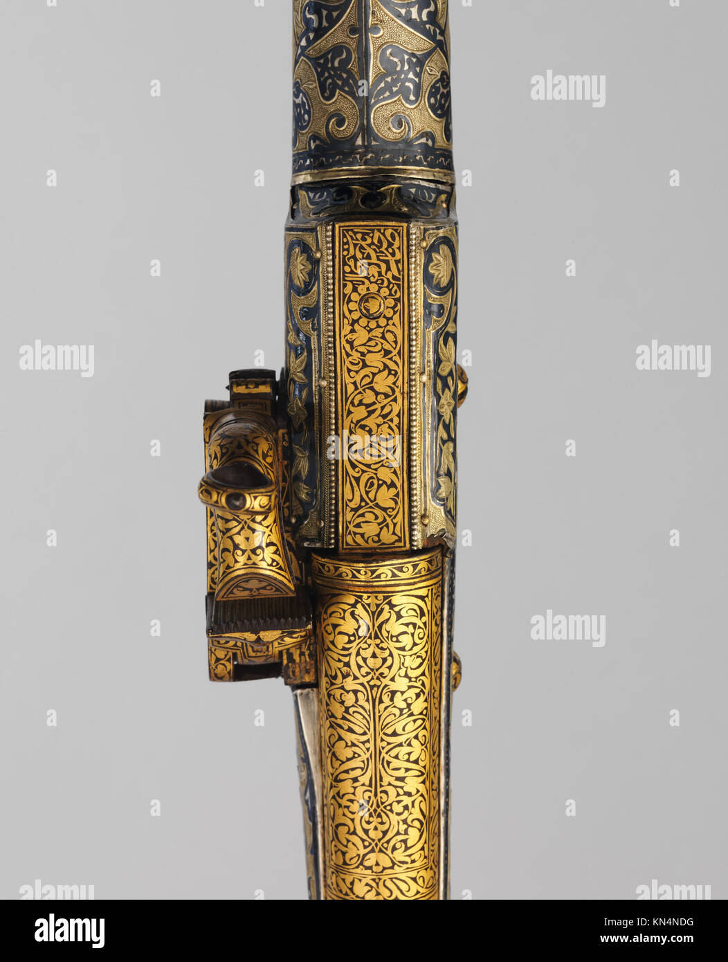 This flintlock rifle, from the 18th or 19th century, features a classic ...