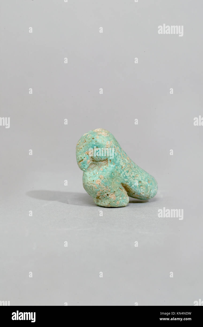 This figurine depicts a crouching falcon, carefully crafted to ...