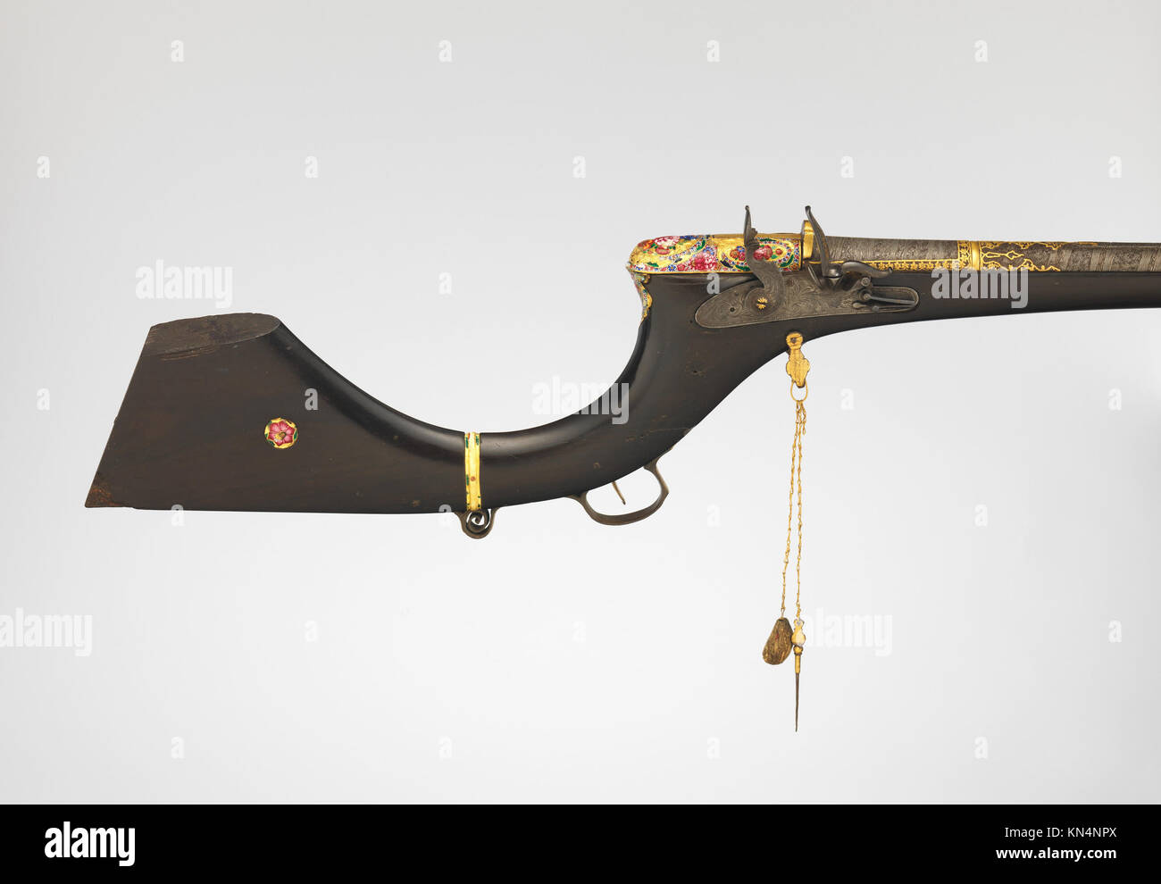 This flintlock gun features intricate design and craftsmanship typical ...