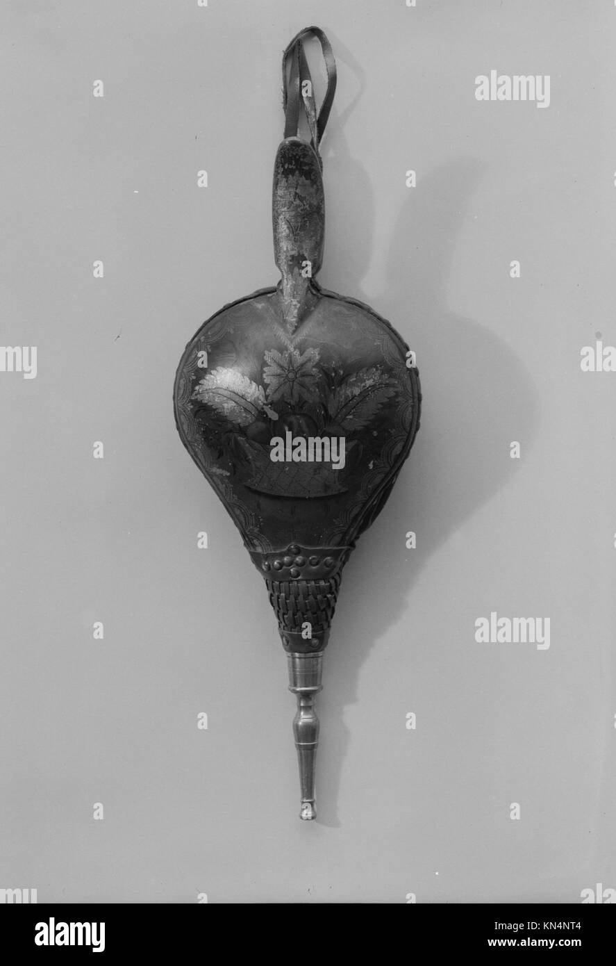 This pair of bellows, used for inflating air into a fire, reflects the ...