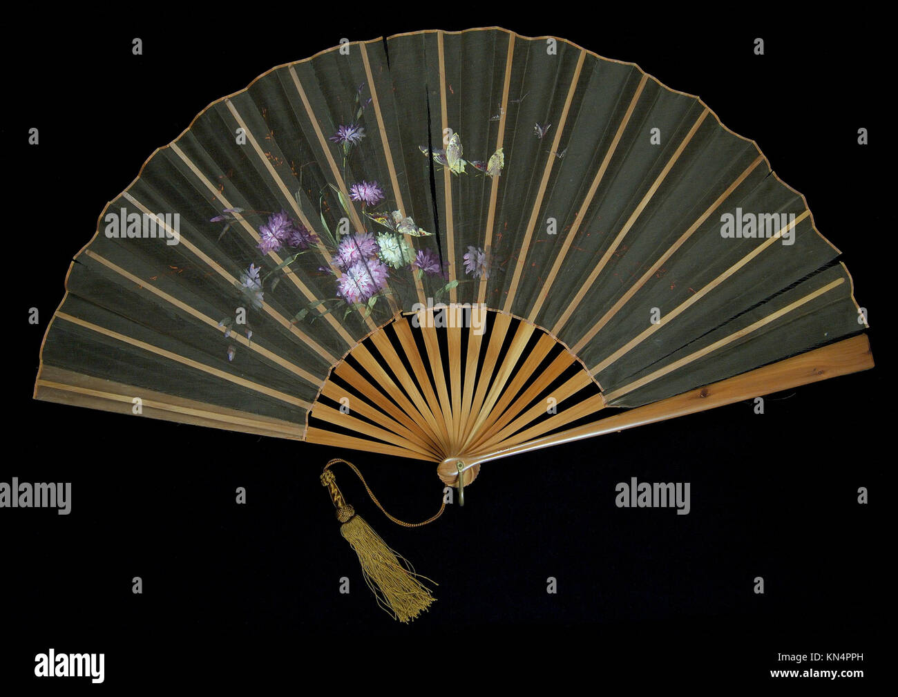 This fan, made of delicate materials, features detailed craftsmanship ...