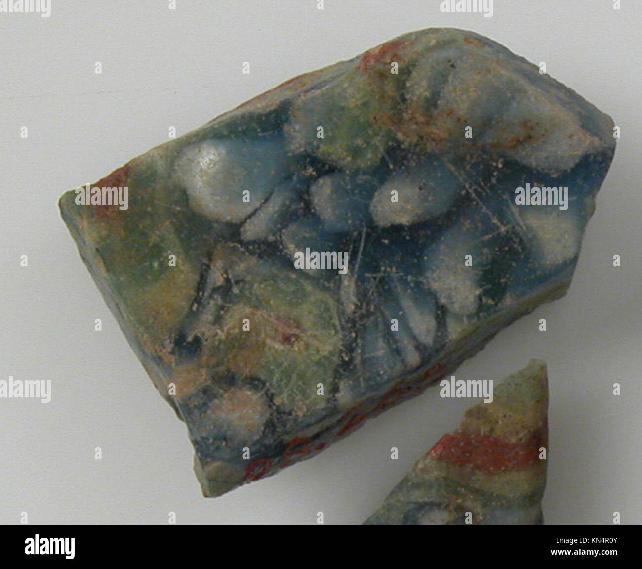 Glass fragments from an ancient vessel, showing early glassworking ...