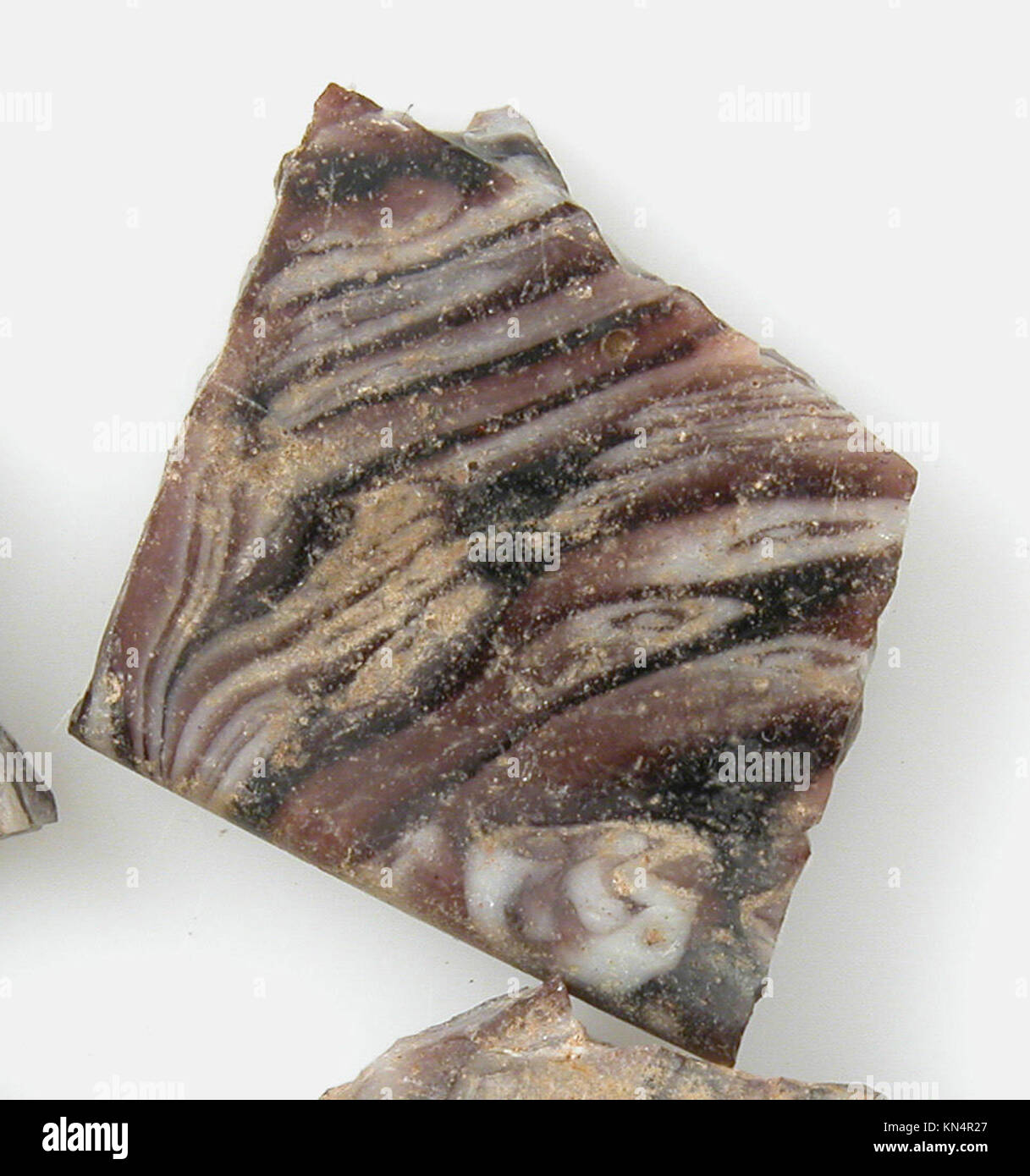 Glass fragments from an ancient vessel, reflecting the craftsmanship ...