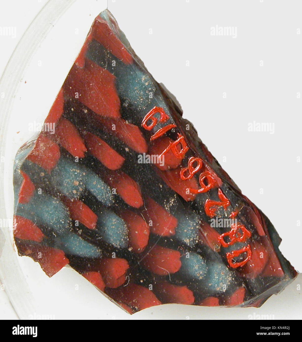 These glass fragments, part of a vessel, provide a glimpse into ancient ...