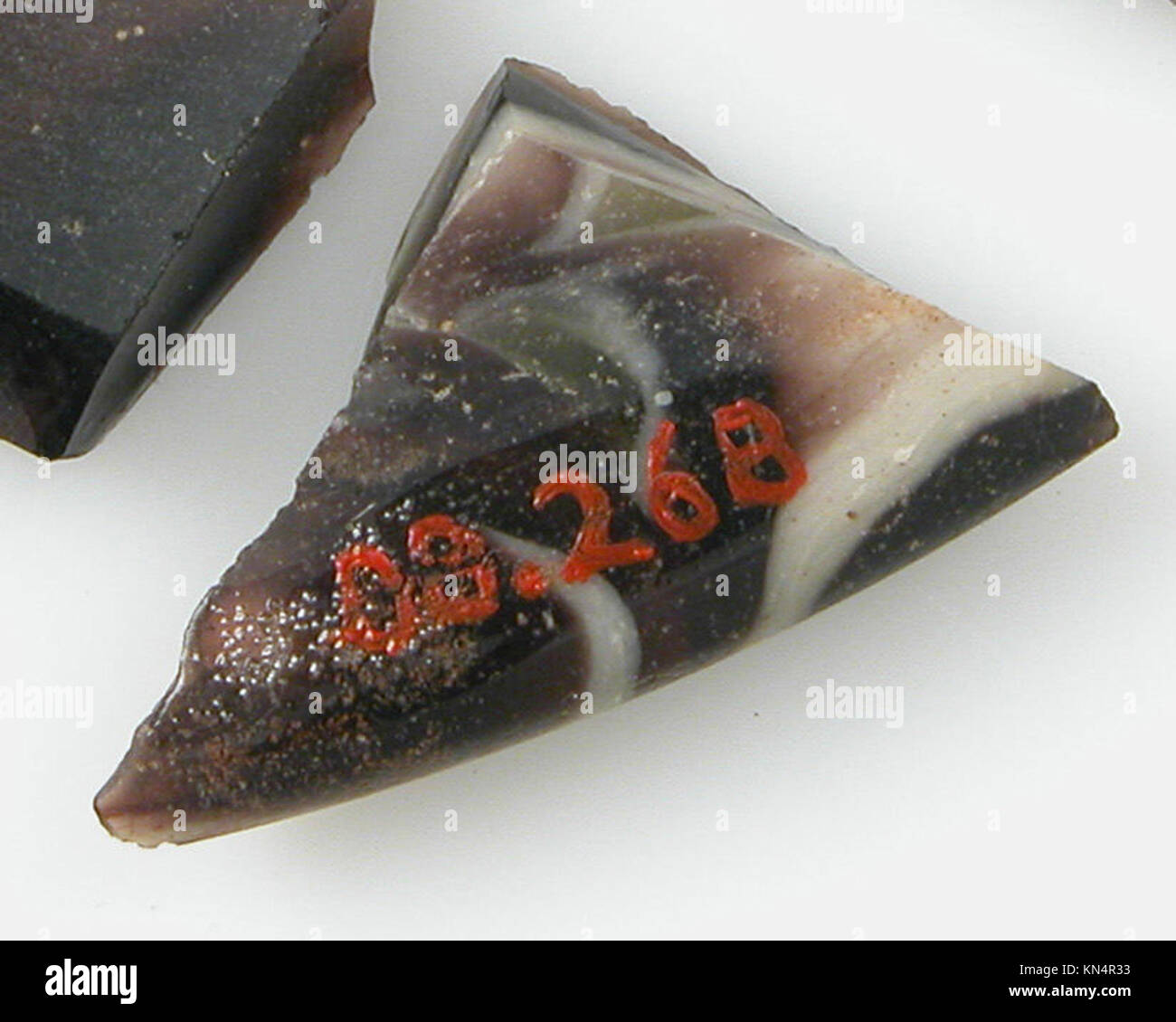 These glass fragments, originating from a vessel, are archaeological ...