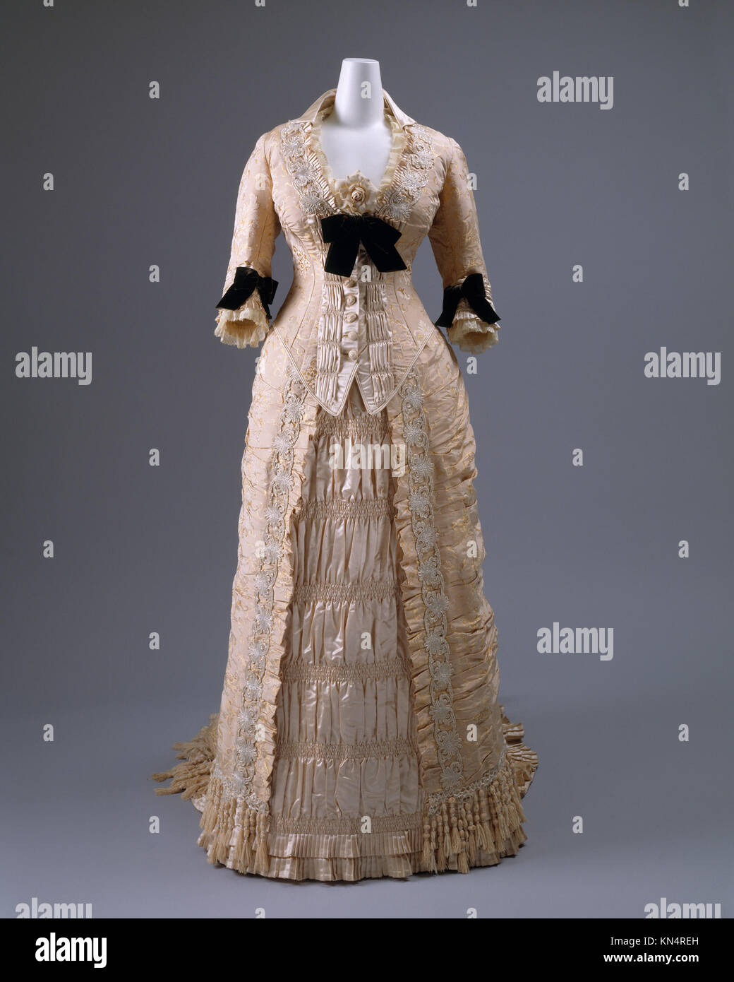 This elegant dinner dress, part of the MET collection, showcases the ...