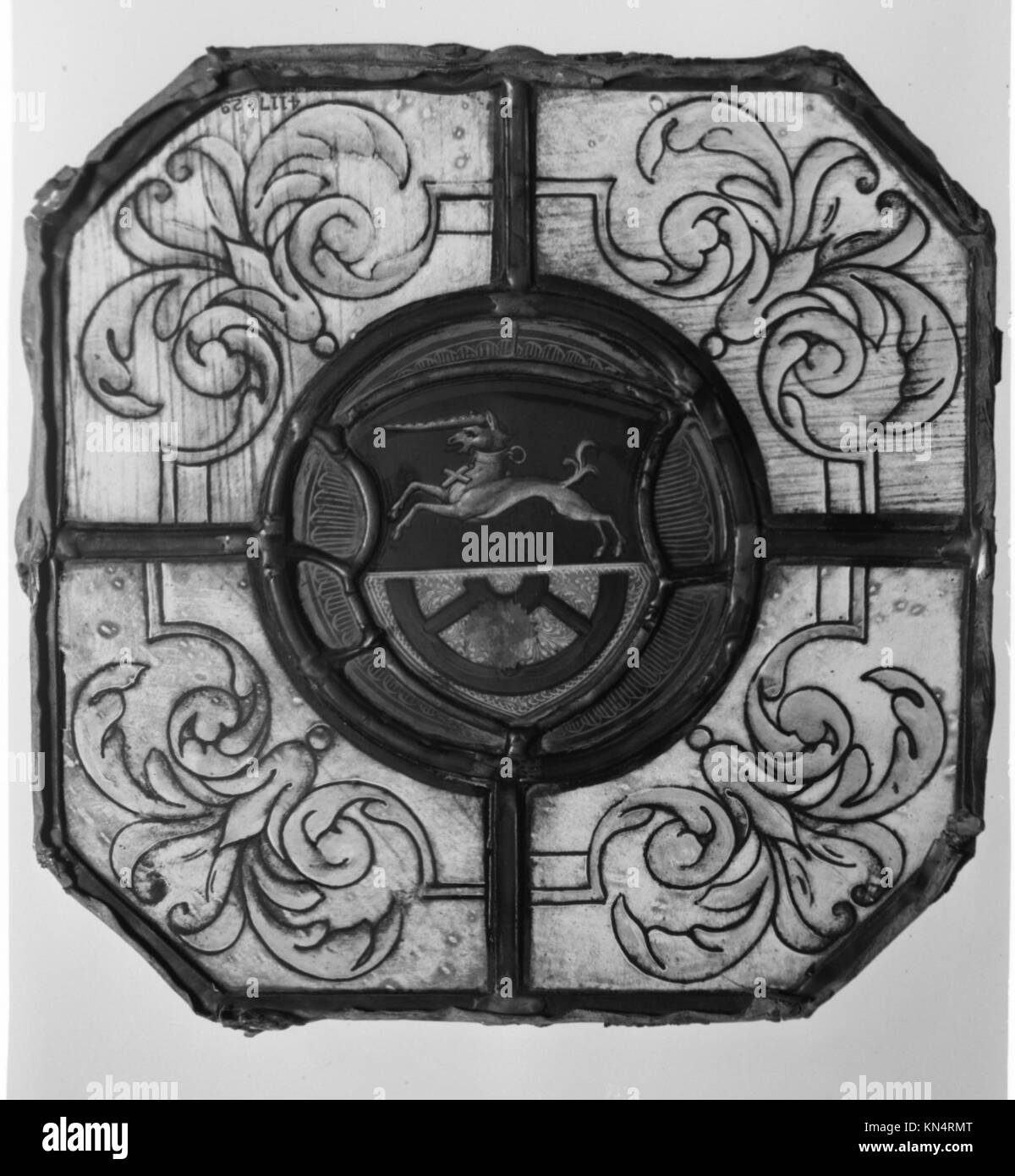 This armorial panel, MET 126372 209440, displays heraldic symbols and ...